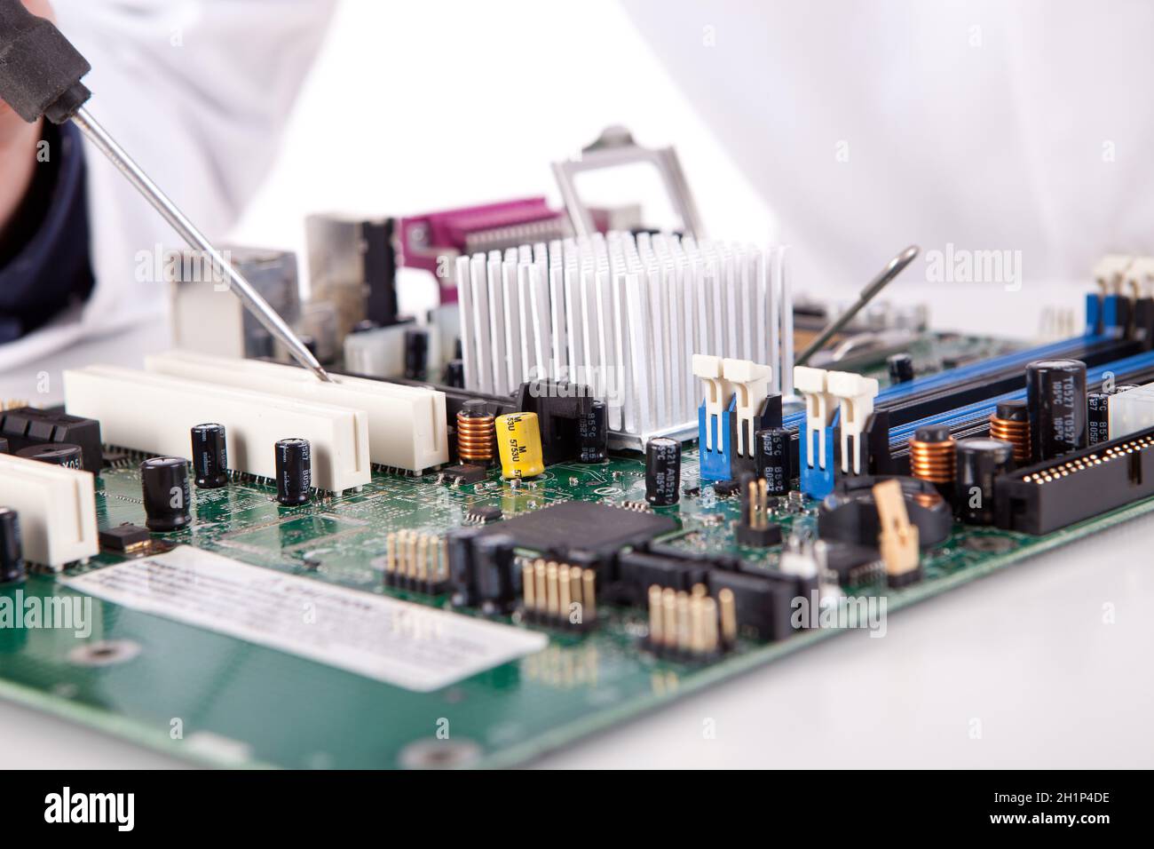 Computer engineer working on an old motherboard Stock Photo - Alamy