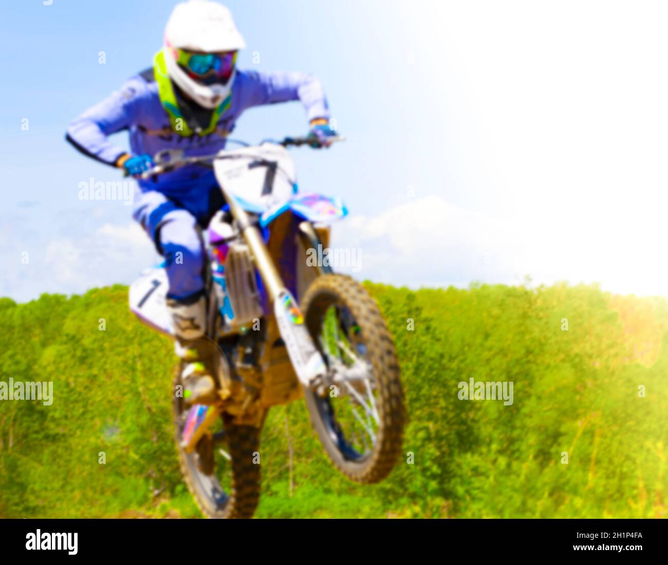 Blurry image of motorcycle rider during motocross race Stock Photo - Alamy