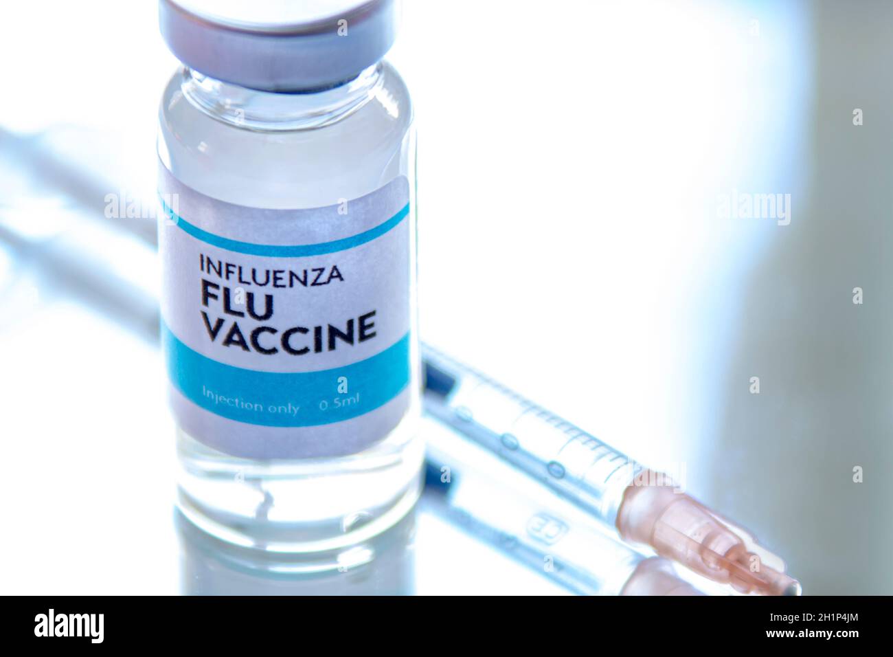 A Bottle of Influenza Flu vaccine on a Sterile Transparent Vial with a ...