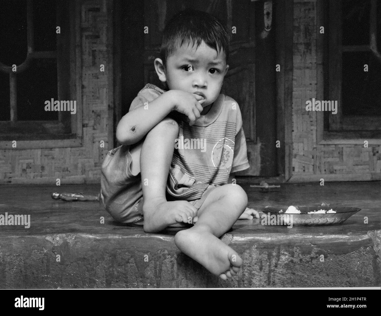 Young child looking at camera Stock Photo - Alamy