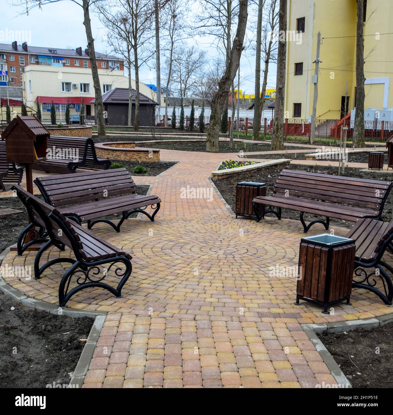 Benches in the park. Sidewalk tile in the park. Infrastructure of ...