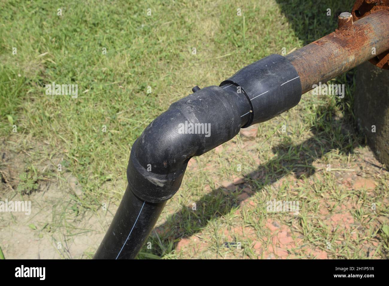 The pipe from the water tower. Steel or plastic pipe, valve and knee on ...