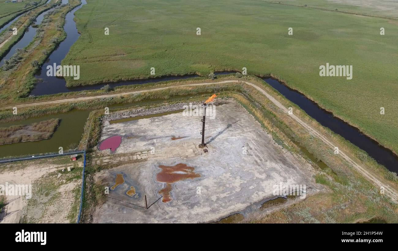 System of a torch on an oil field. Area flare system Stock Photo - Alamy
