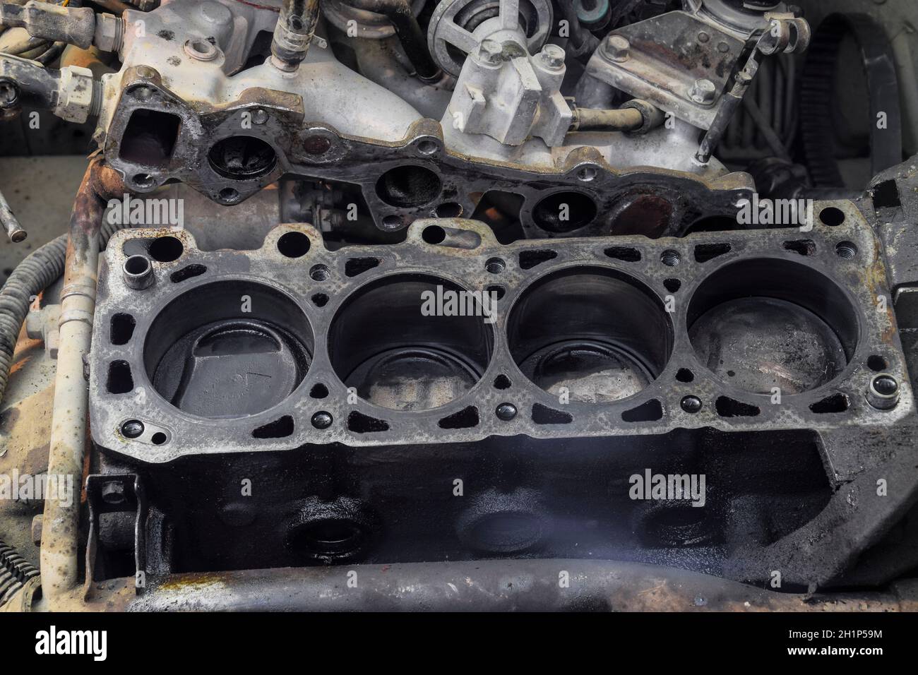 The cylinder block of the four-cylinder engine. Disassembled motor ...