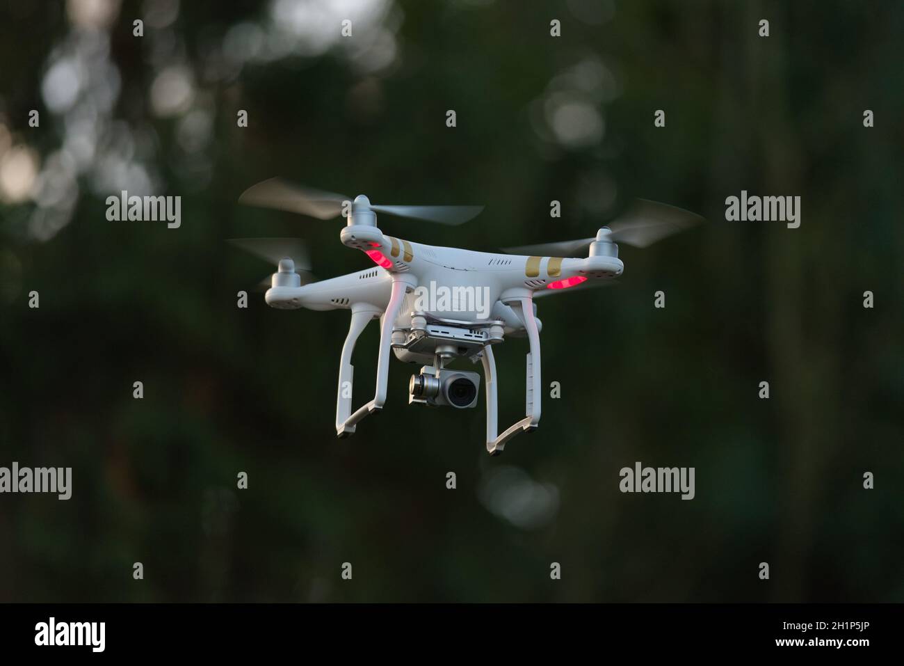 6 - Common white camera drone used for surveillance, plain background ...