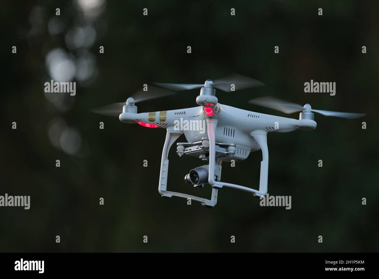 19 - UAV remote controlled commercial quad copter drone hovering. Hobby ...