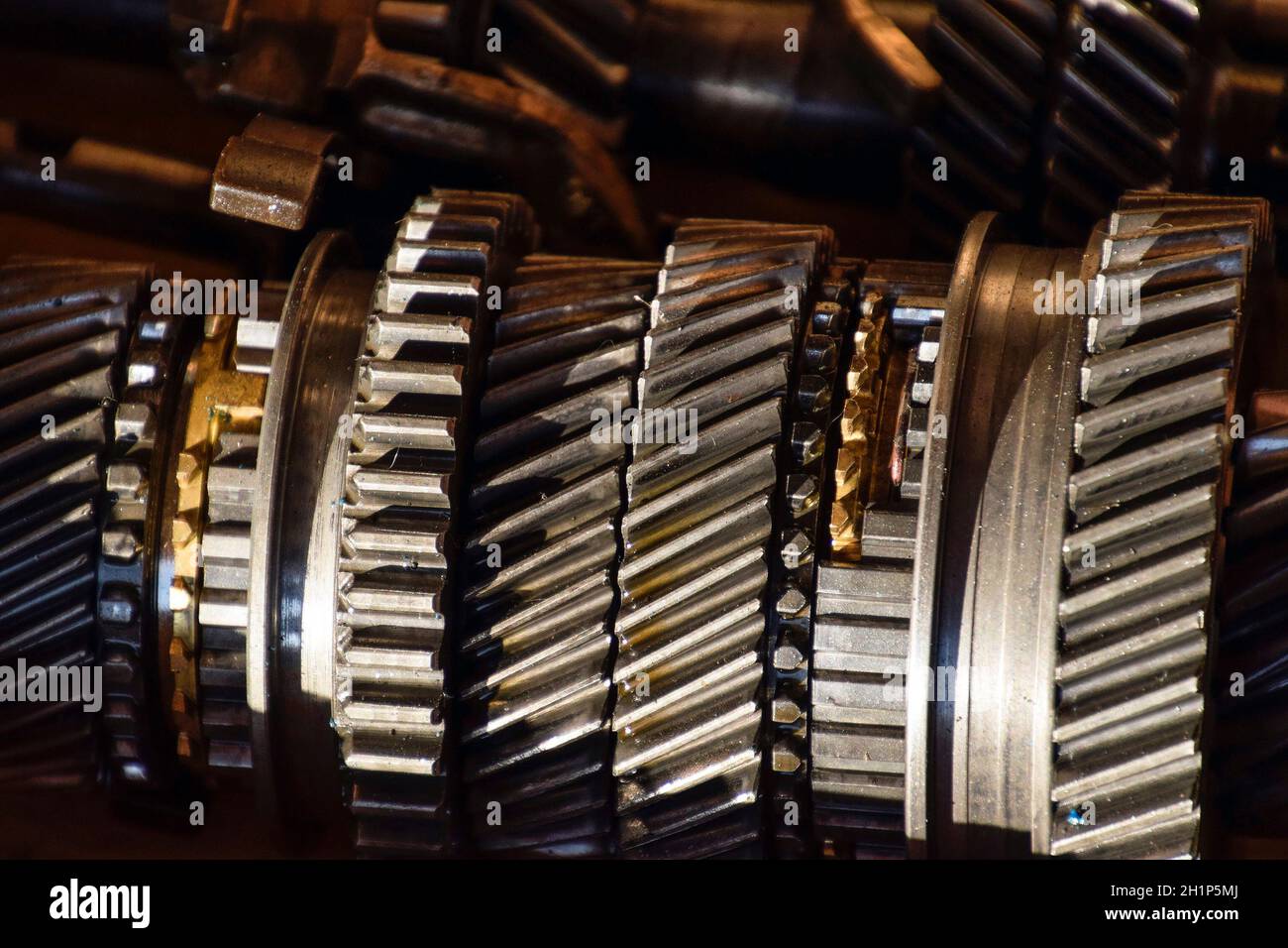 Dismantled box car transmissions. The gears on the shaft of a ...