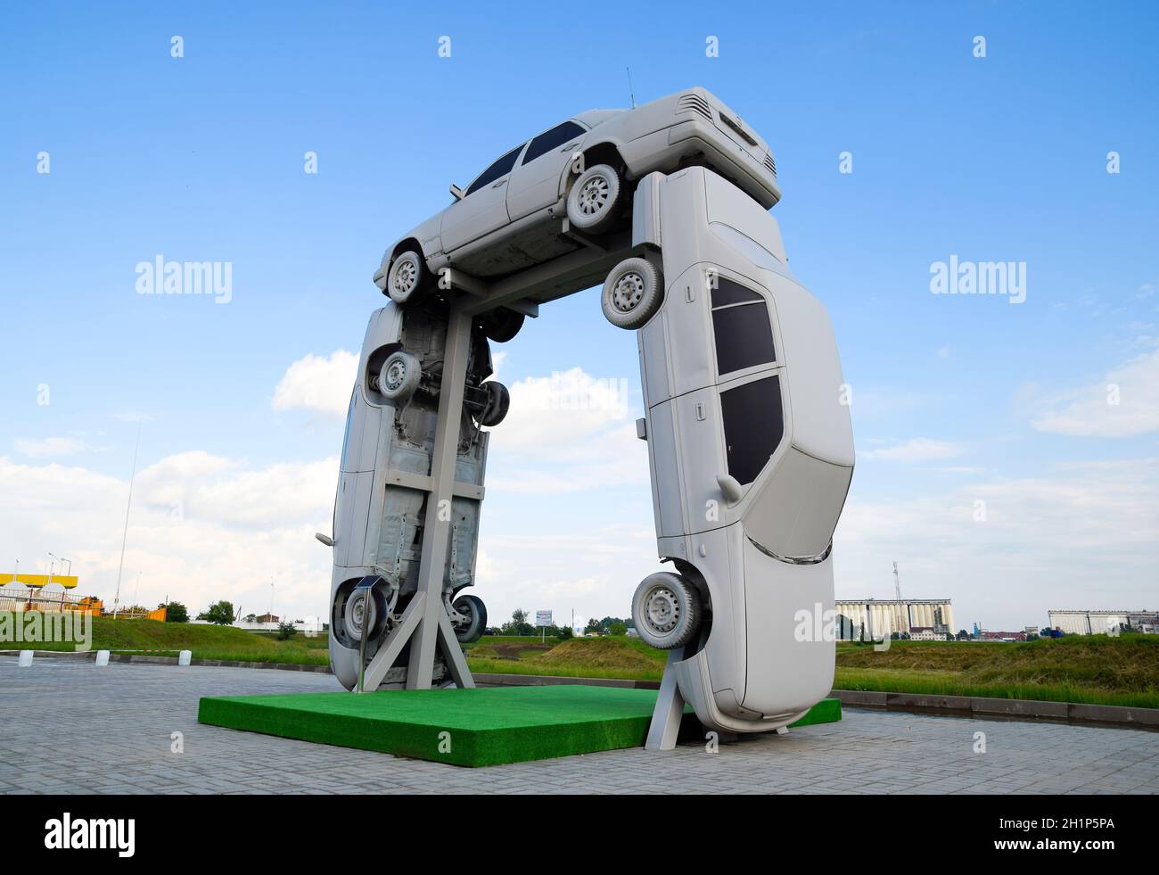 Homemade sculpture of three cars. Monument to the cyrillic letter P ...