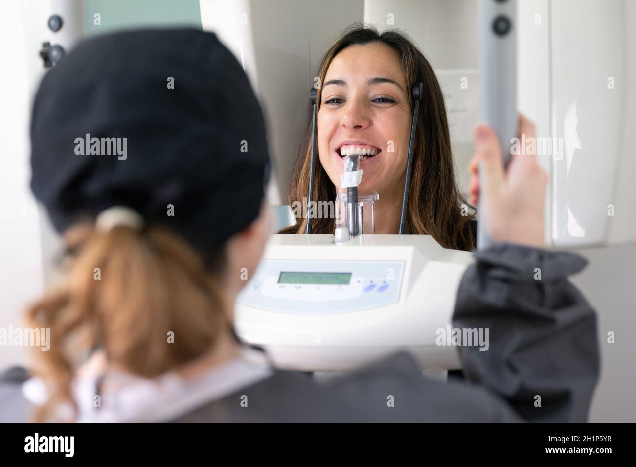 Young woman patient standing in x-ray machine. High quality photo Stock ...