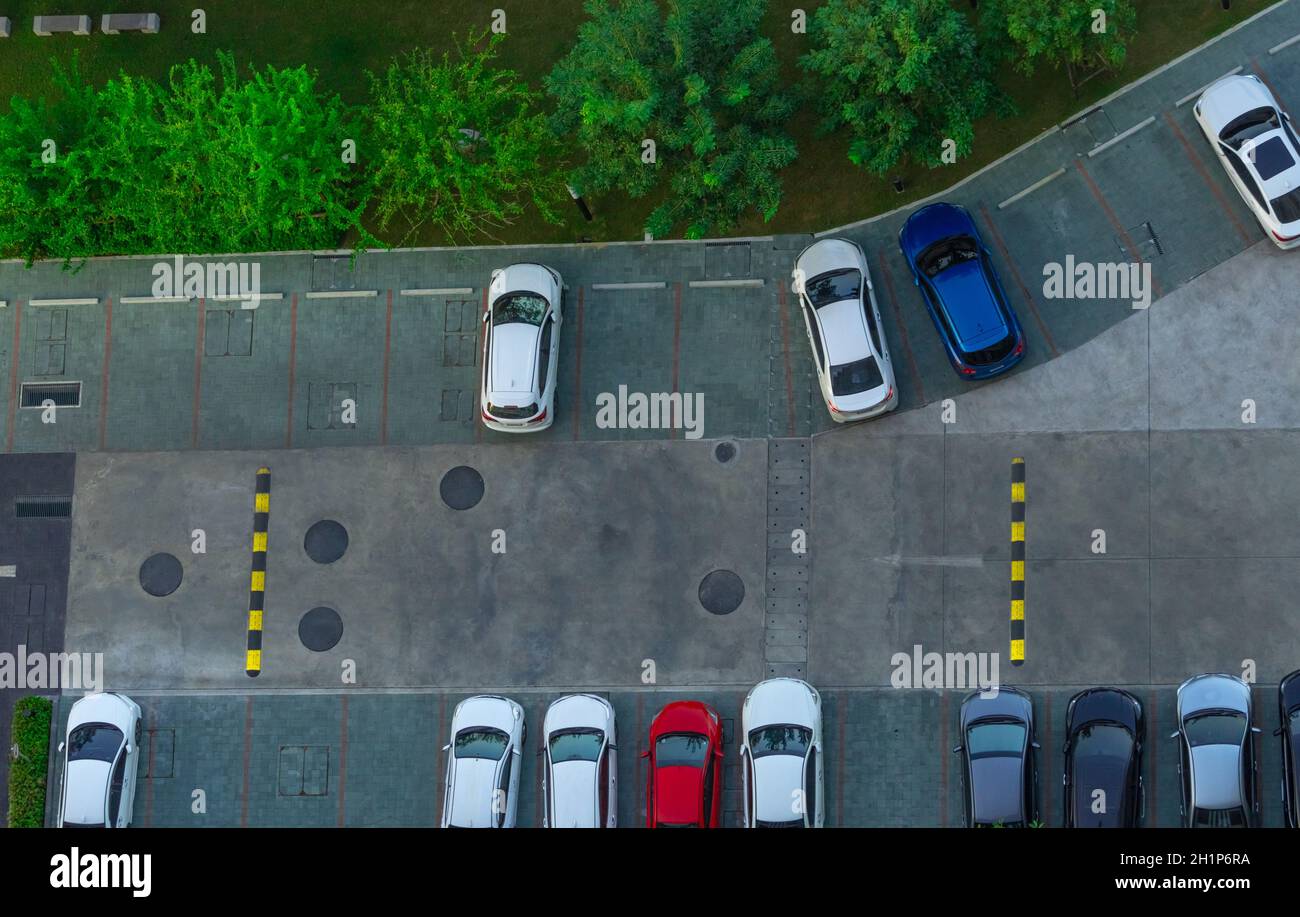 Above view of cars parked at car parking area of the apartment. Aerial ...