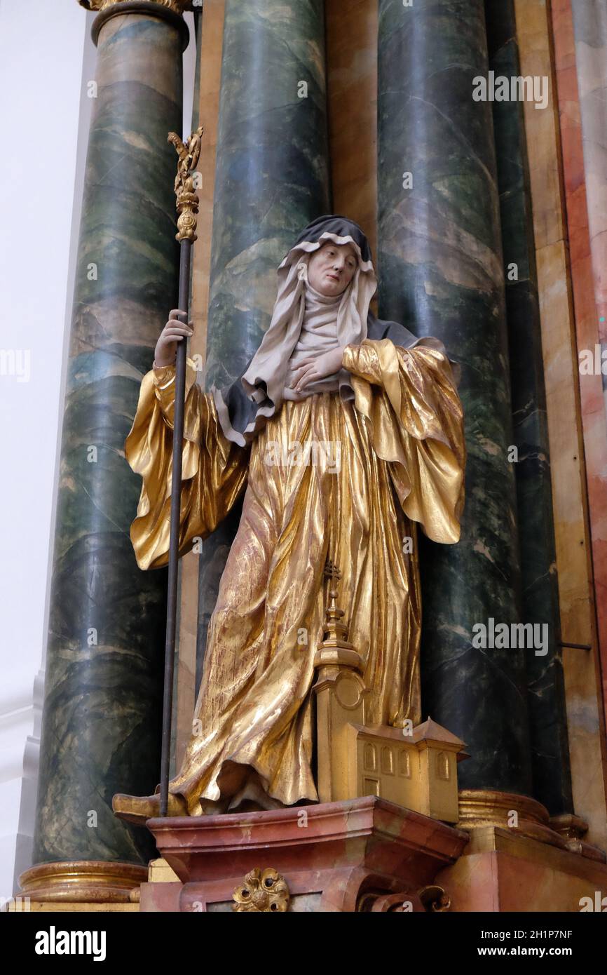 Statue of Saint, Altar in Collegiate church in Salzburg Stock Photo - Alamy