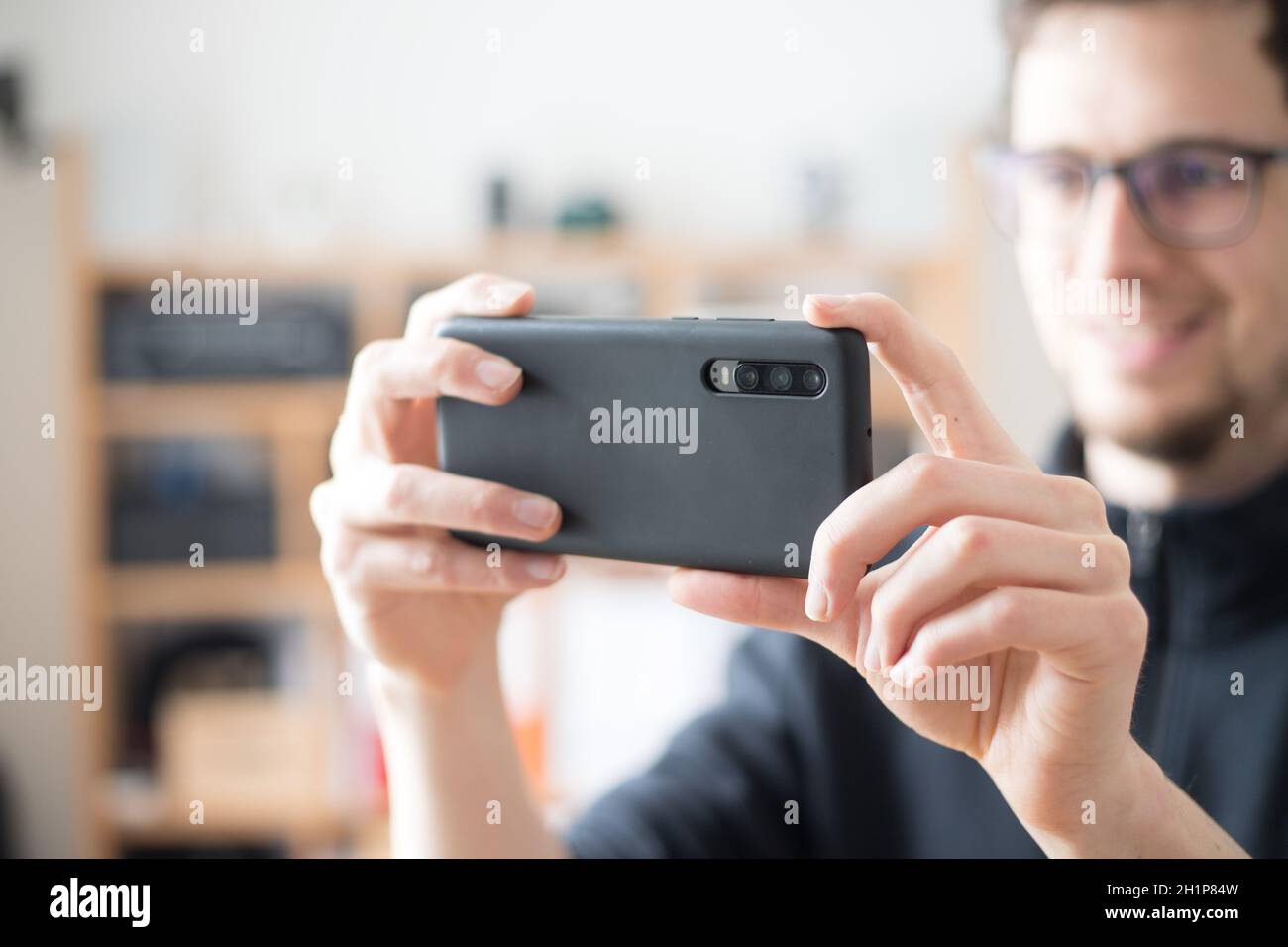 Close up of black smartphone camera, filming and making pictures ...