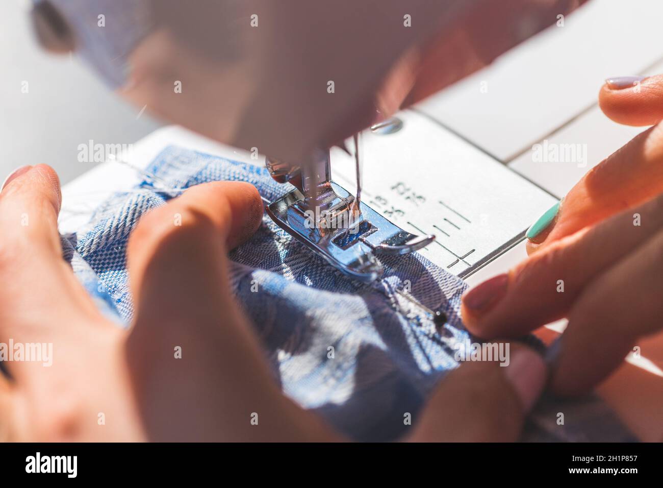 Close up of sewer working with textile and sewing needle Stock Photo ...