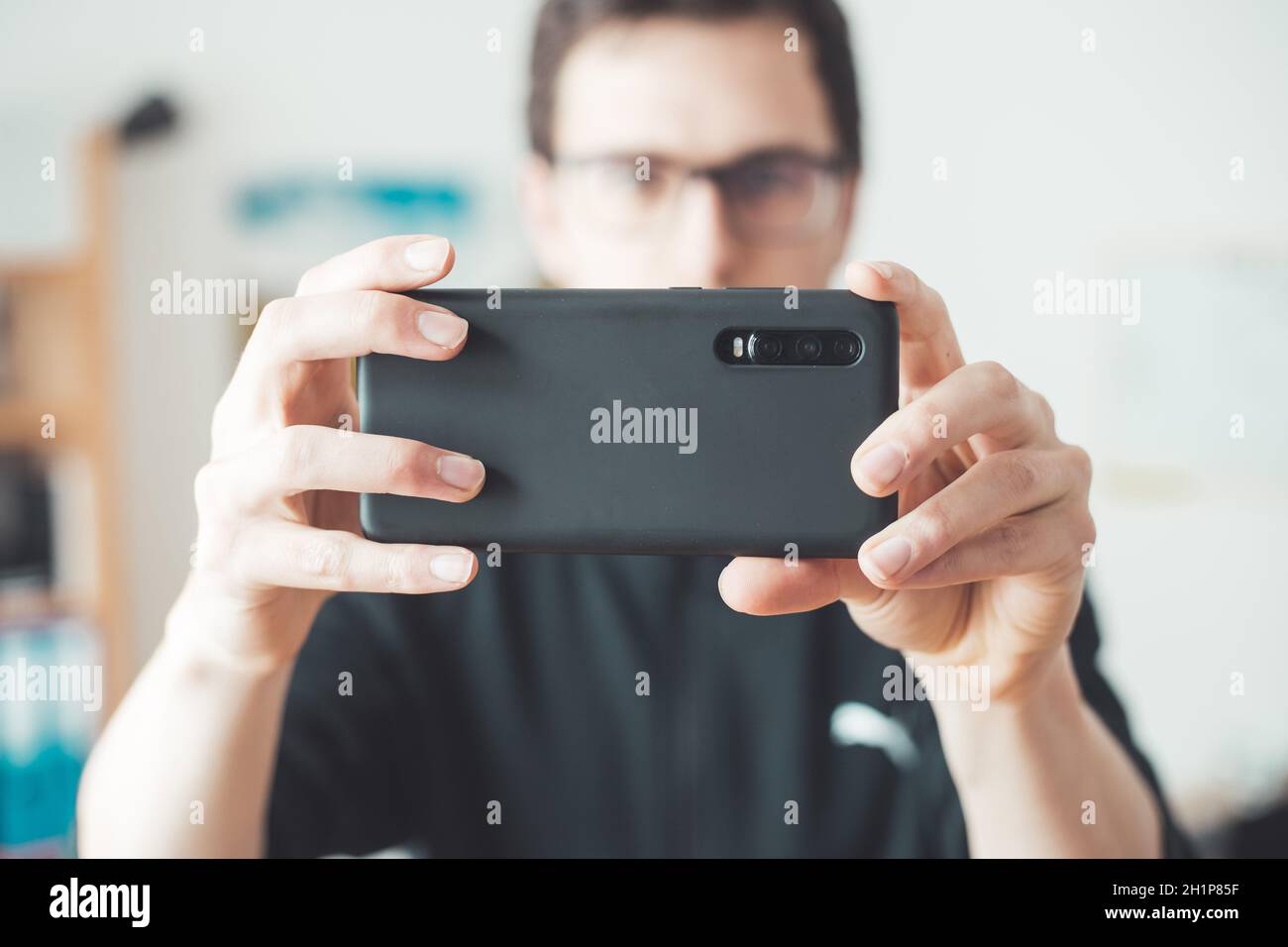 Close up of black smartphone camera, filming and making pictures ...