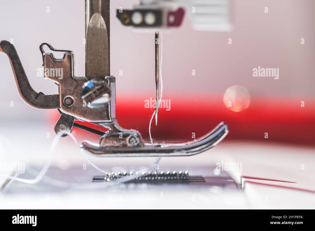 Close up of sewing metal sewing needle with sewing thread Stock Photo ...
