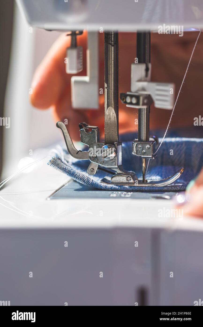 Close up of sewing metal sewing needle with sewing thread Stock Photo ...