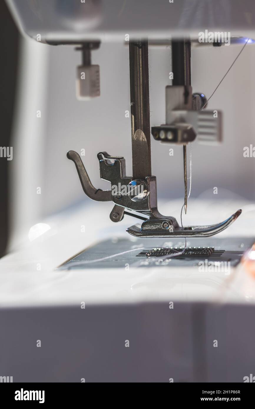 Close up of sewing metal sewing needle with sewing thread Stock Photo ...