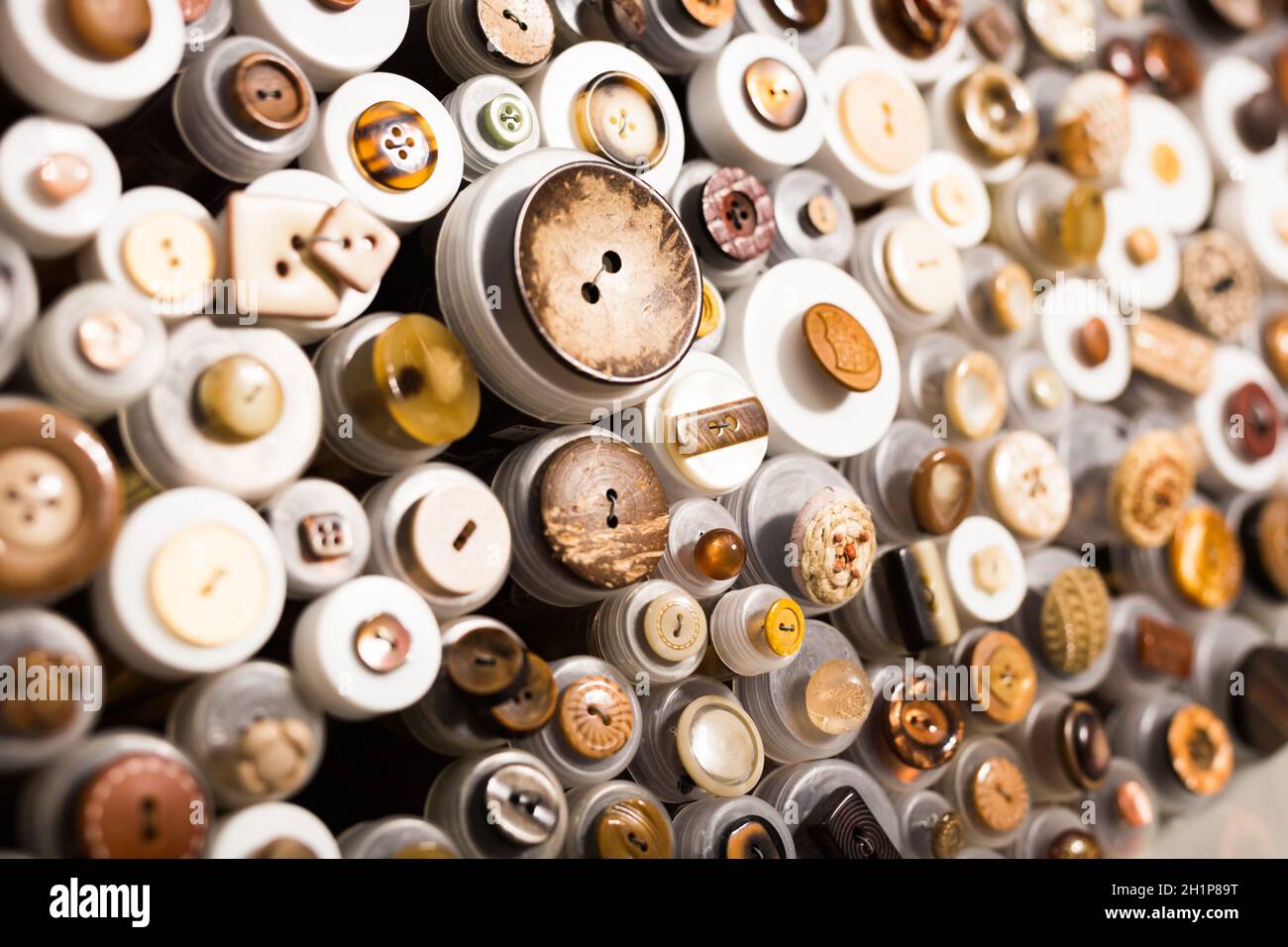 Buttons in plastic containers in store Stock Photo - Alamy