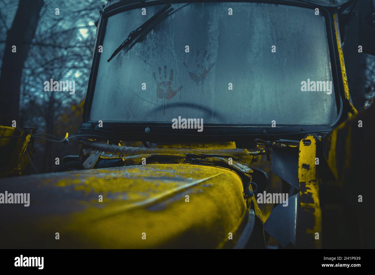 An old rusty tractor from the front with creepy handprints on the ...