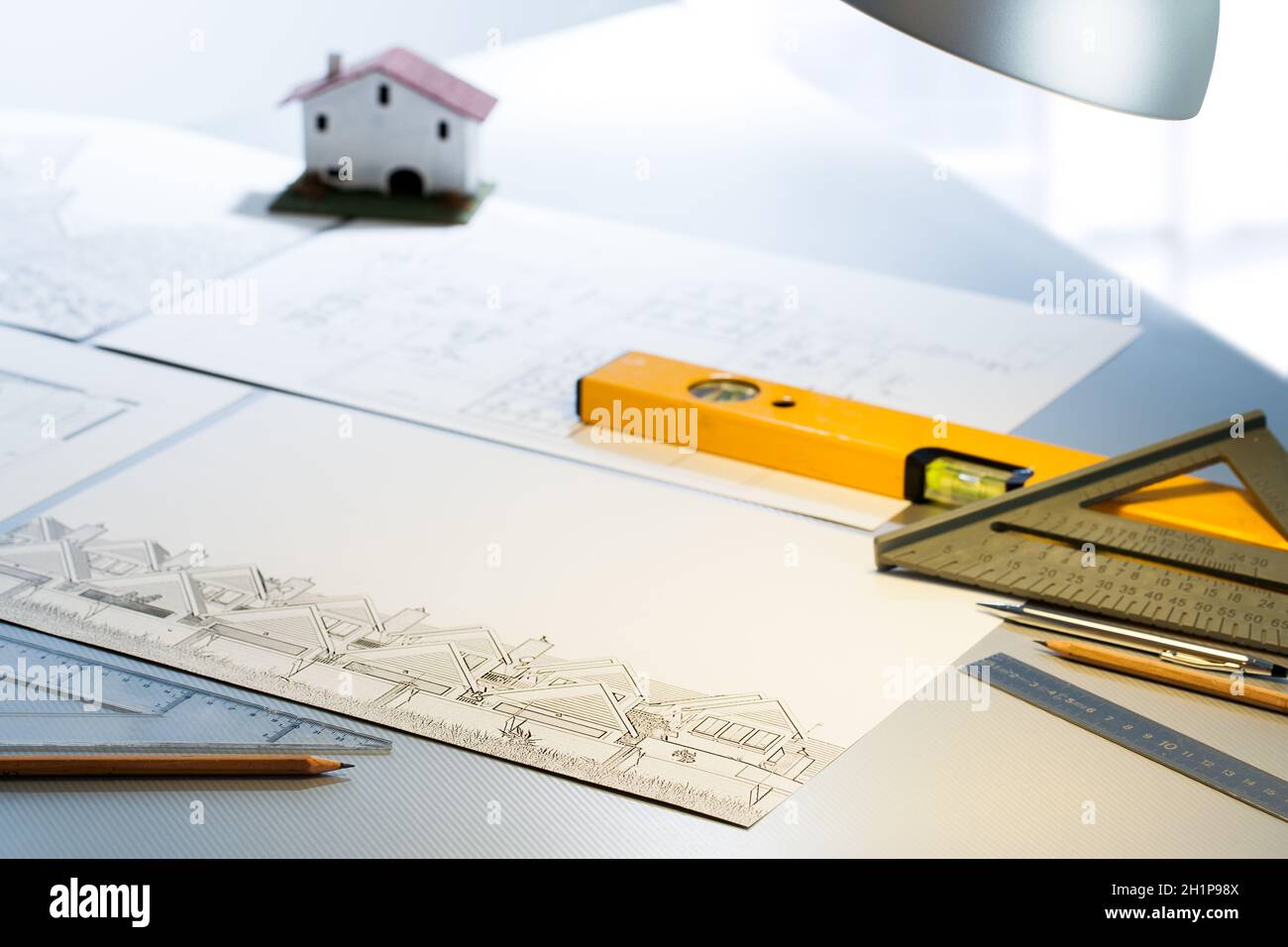 Detail of architect desk with technical drawings and measuring tools ...