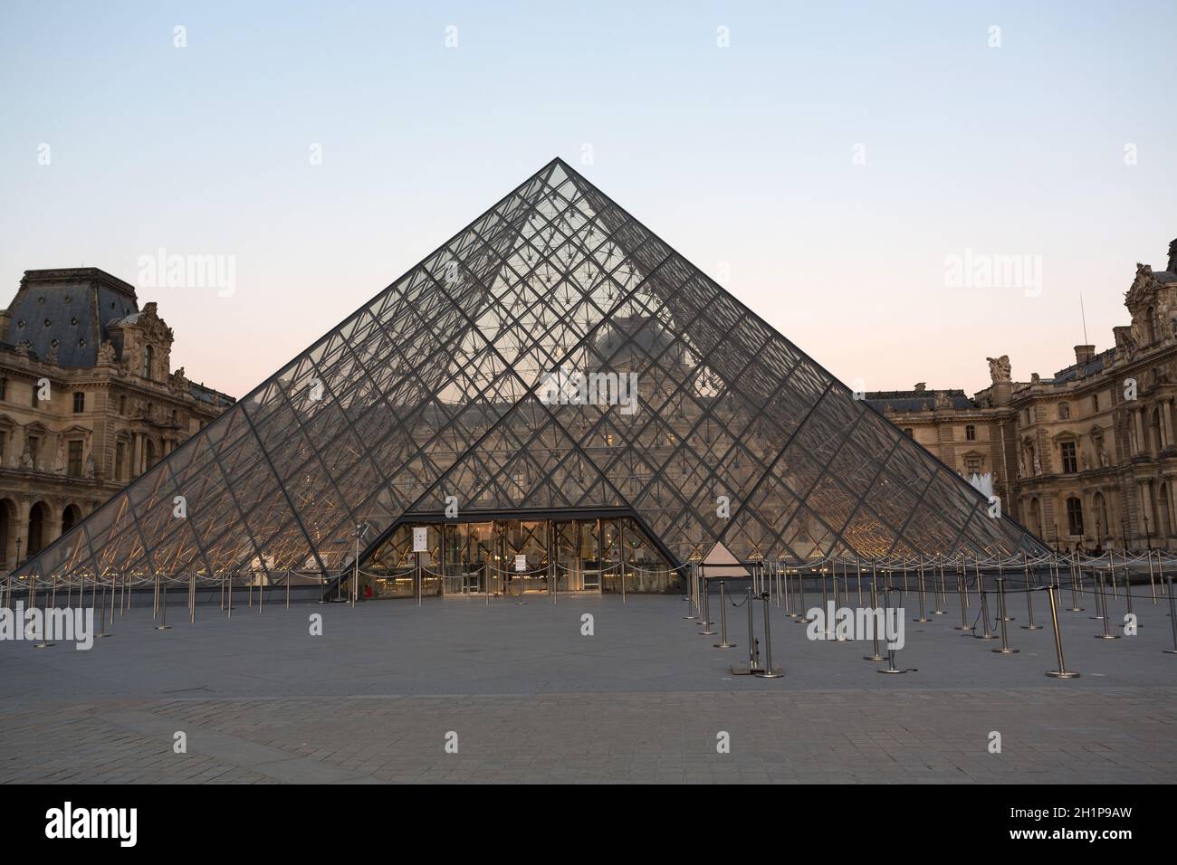 PARIS - AUGUST 15, 2016 Louvre museum at twilight in summer. Louvre ...