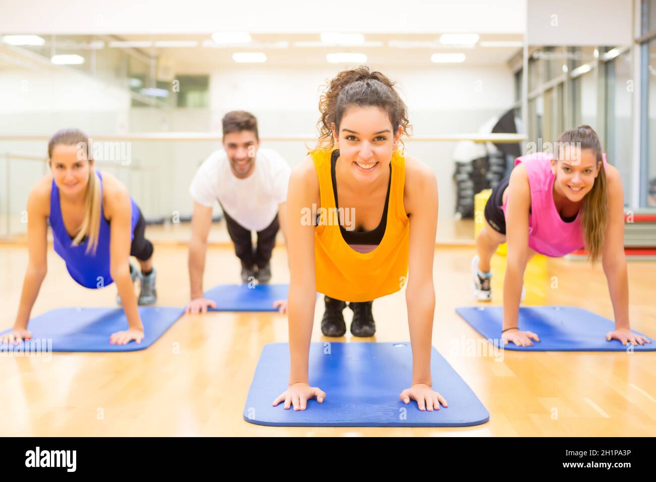 Group of friends working out at the gym Stock Photo - Alamy
