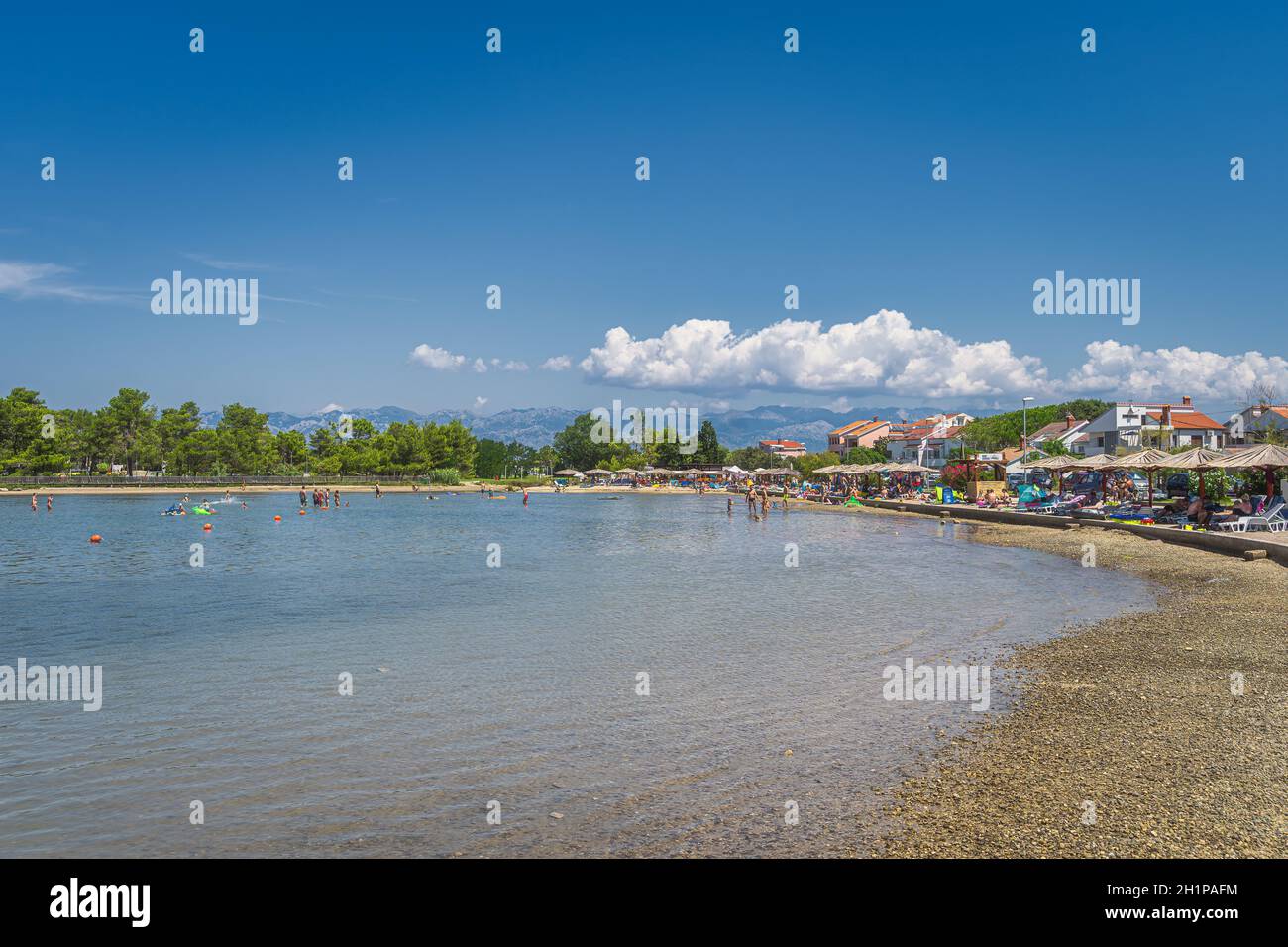 Zaton, Croatia, July 2019 Families having fun in turquoise coloured ...
