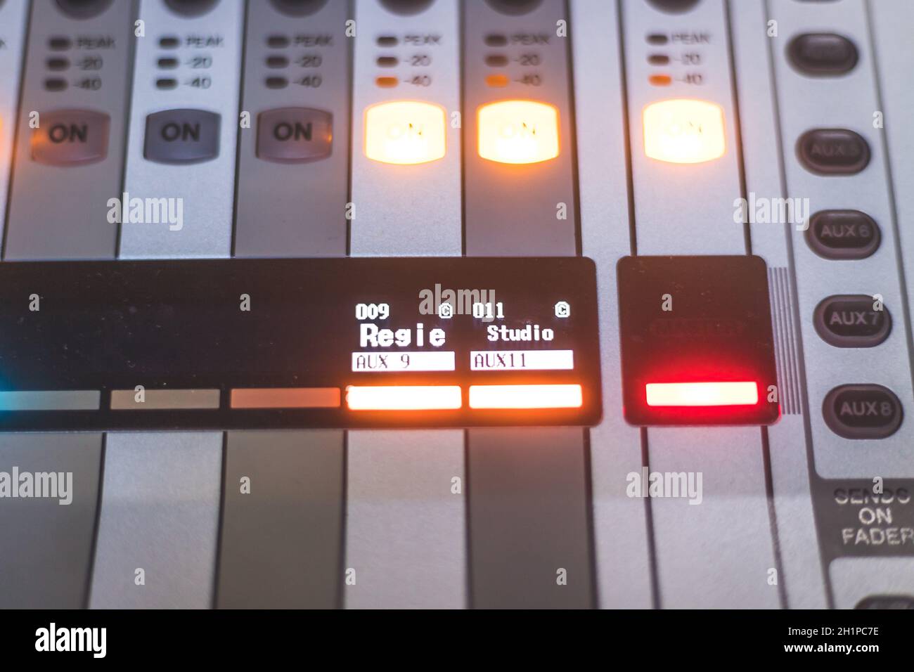 Professional music production in a sound recording studio, mixer desk ...