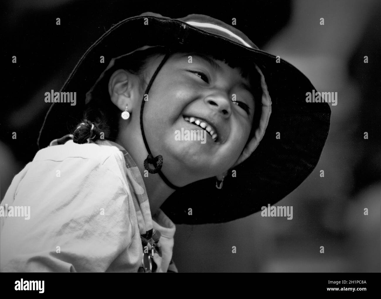 Young child looking at camera Stock Photo - Alamy