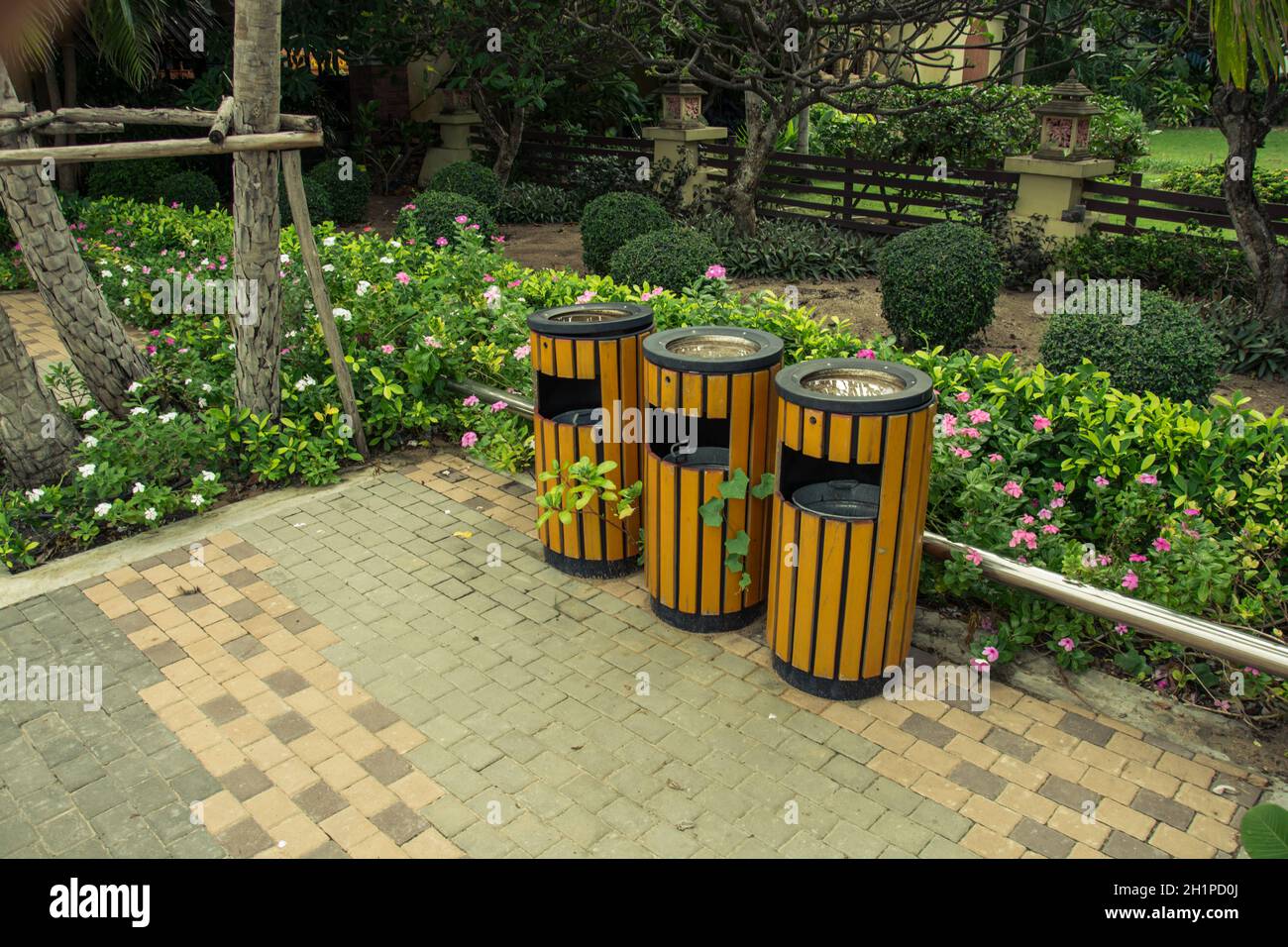 Wood trash bin in the garden Stock Photo - Alamy