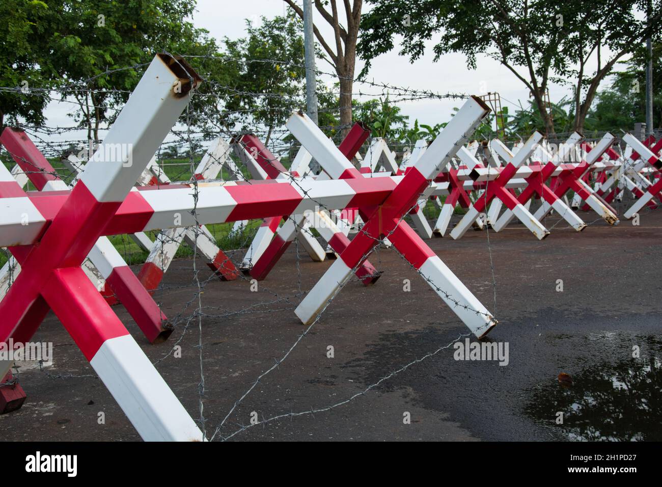 Barbed wire fence block the way Stock Photo - Alamy