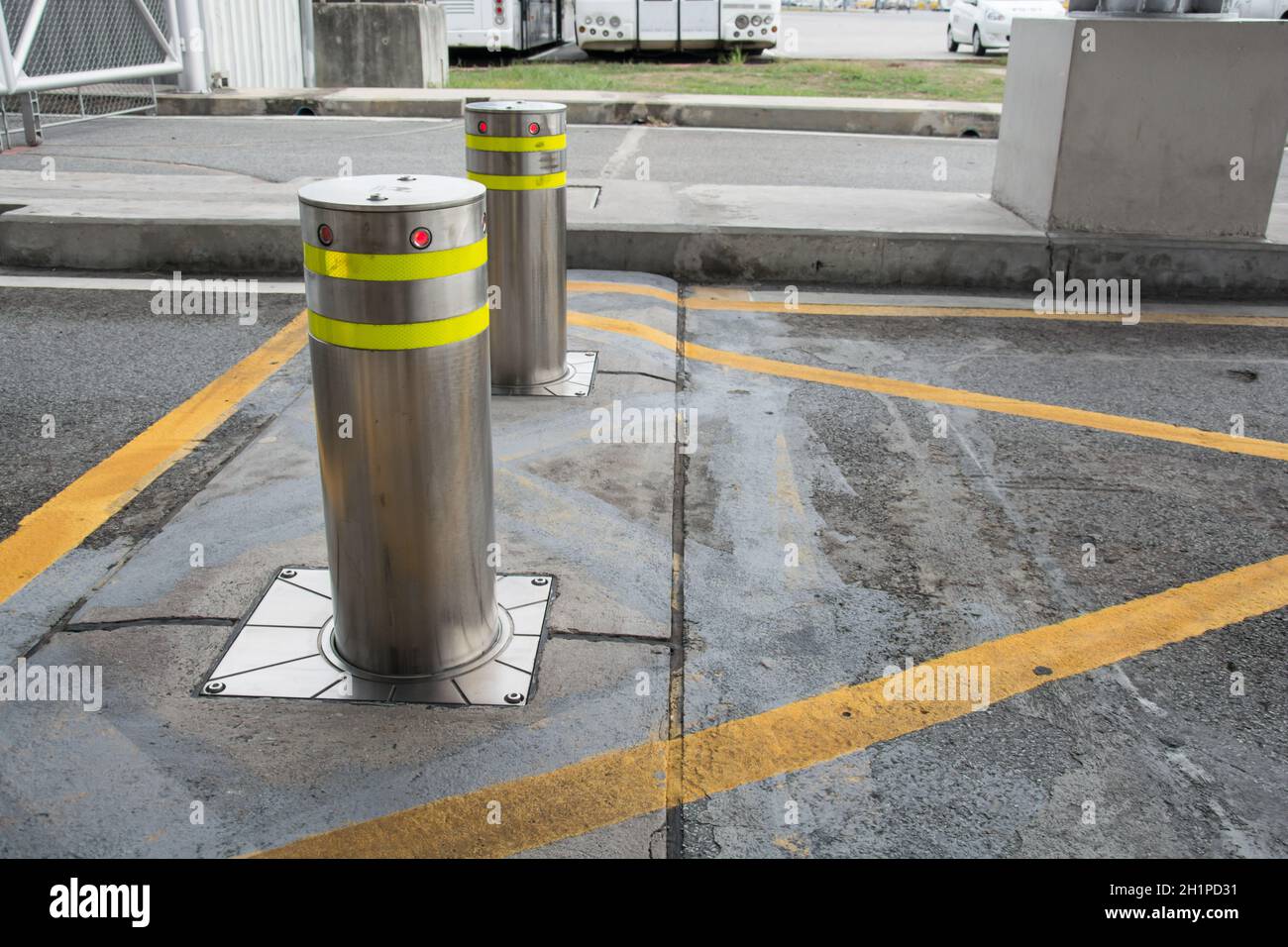 bollards with Security at the gate Stock Photo - Alamy