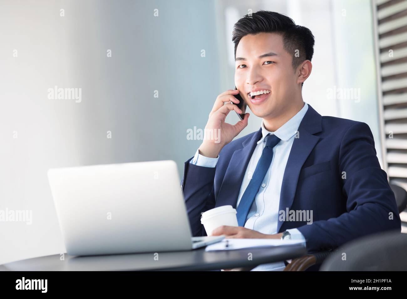 Cheerful businessman laptop talking hi-res stock photography and images ...