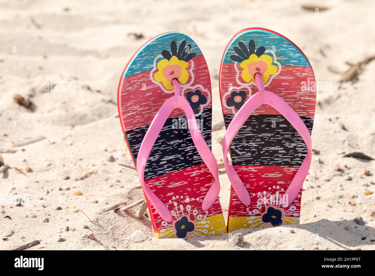 Sandal flip flop on the white sand beach in summer vacations Stock ...