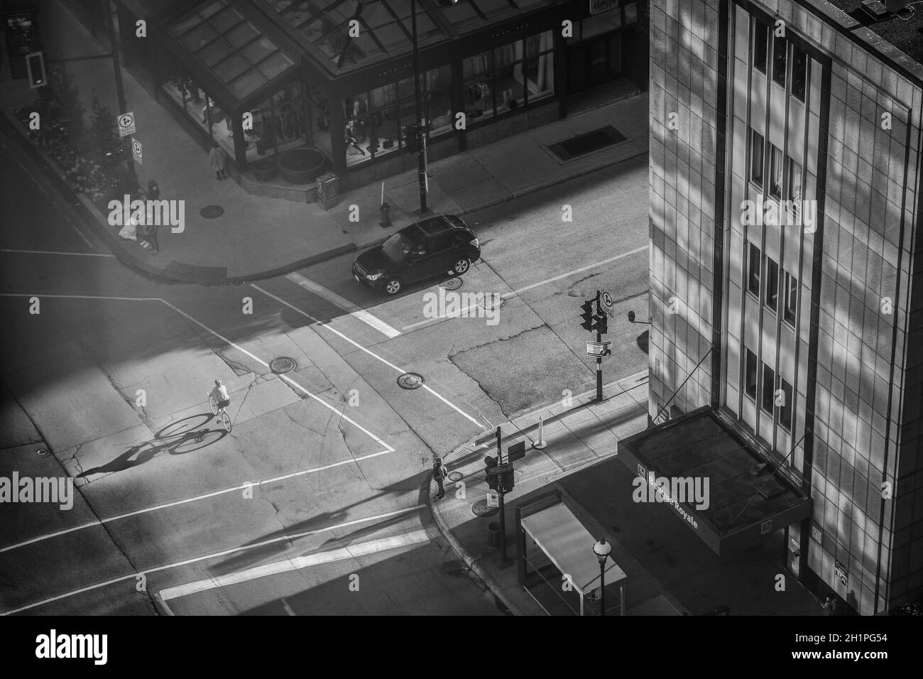 Bicyclist and shadows viewed from above on Sherbrooke Street in ...