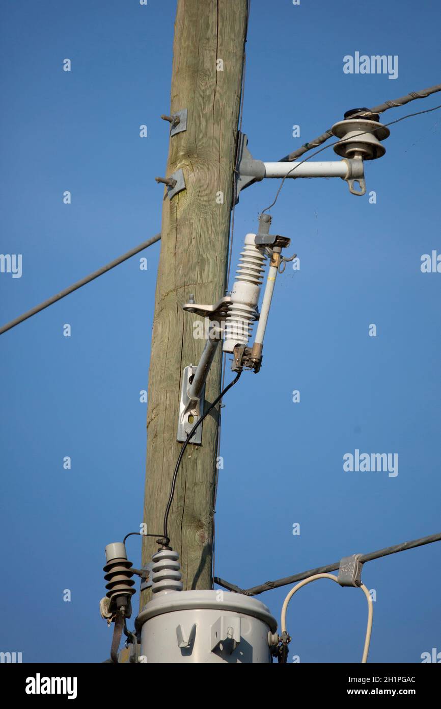 Electrical wires running through the sky, anchored by an electrical ...
