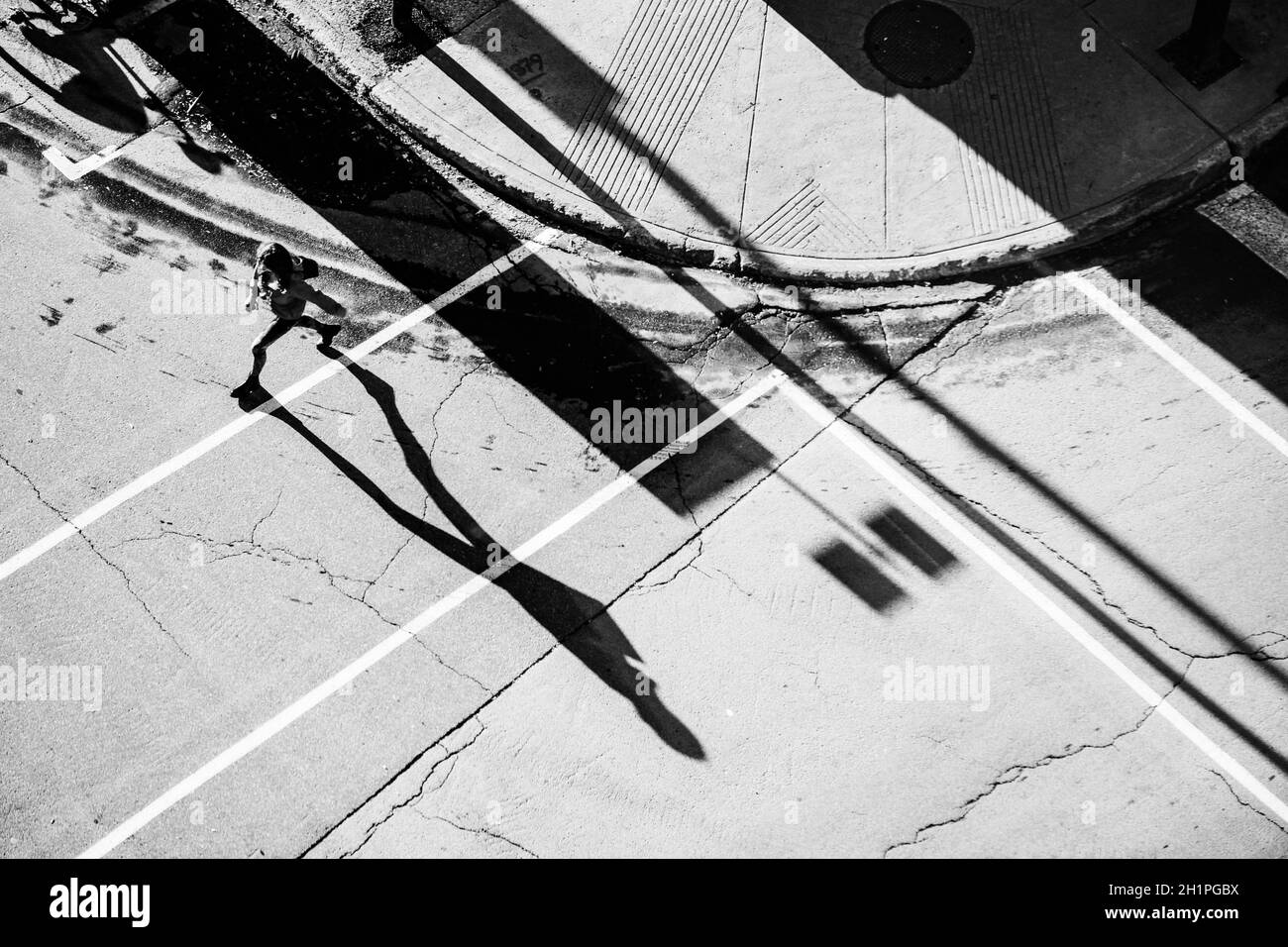 Pedestrians and their shadows viewed from above on Sherbrooke Street in ...