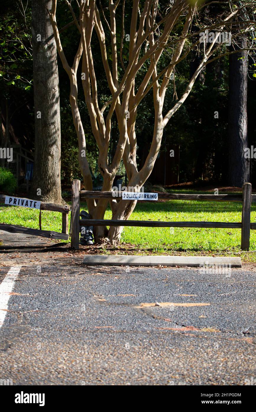 White and black police parking sign on a wooden fence Stock Photo - Alamy