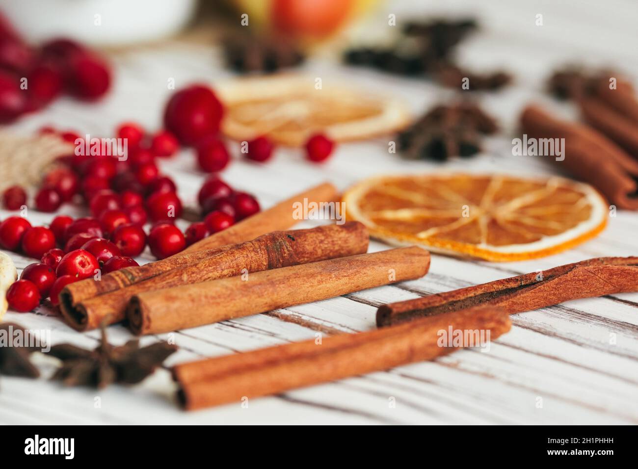 Berries and spices for mulled wine cooking close up on kitchen table ...