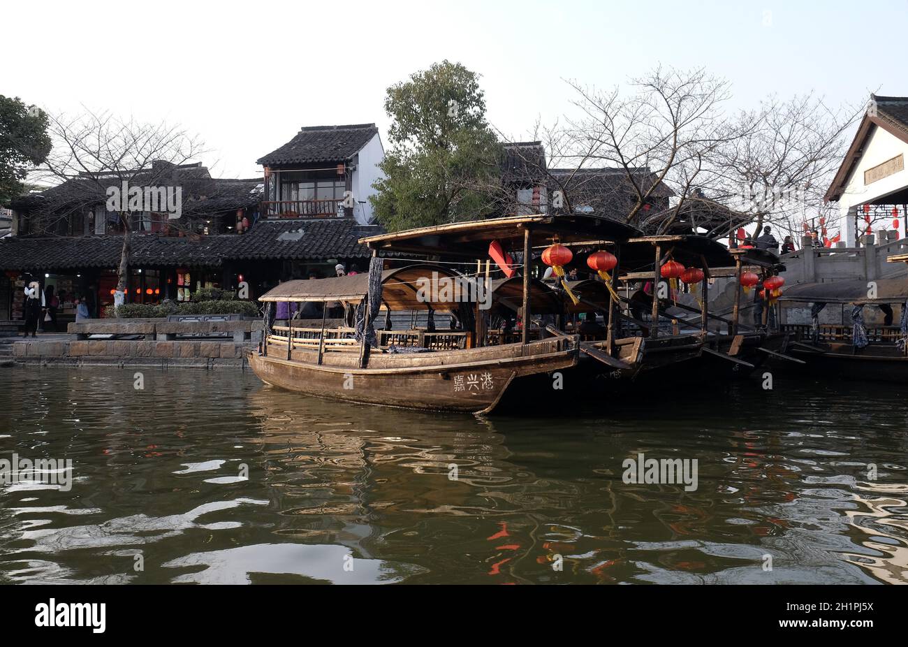 Tourist boats on the water canals of Xitang Town in Zhejiang Province ...