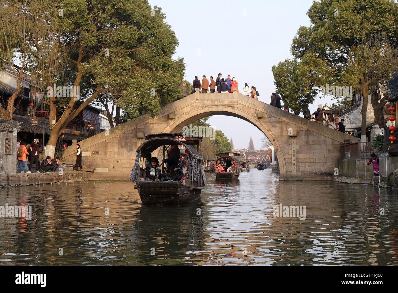 Tourist boats on the water canals of Xitang Town in Zhejiang Province ...