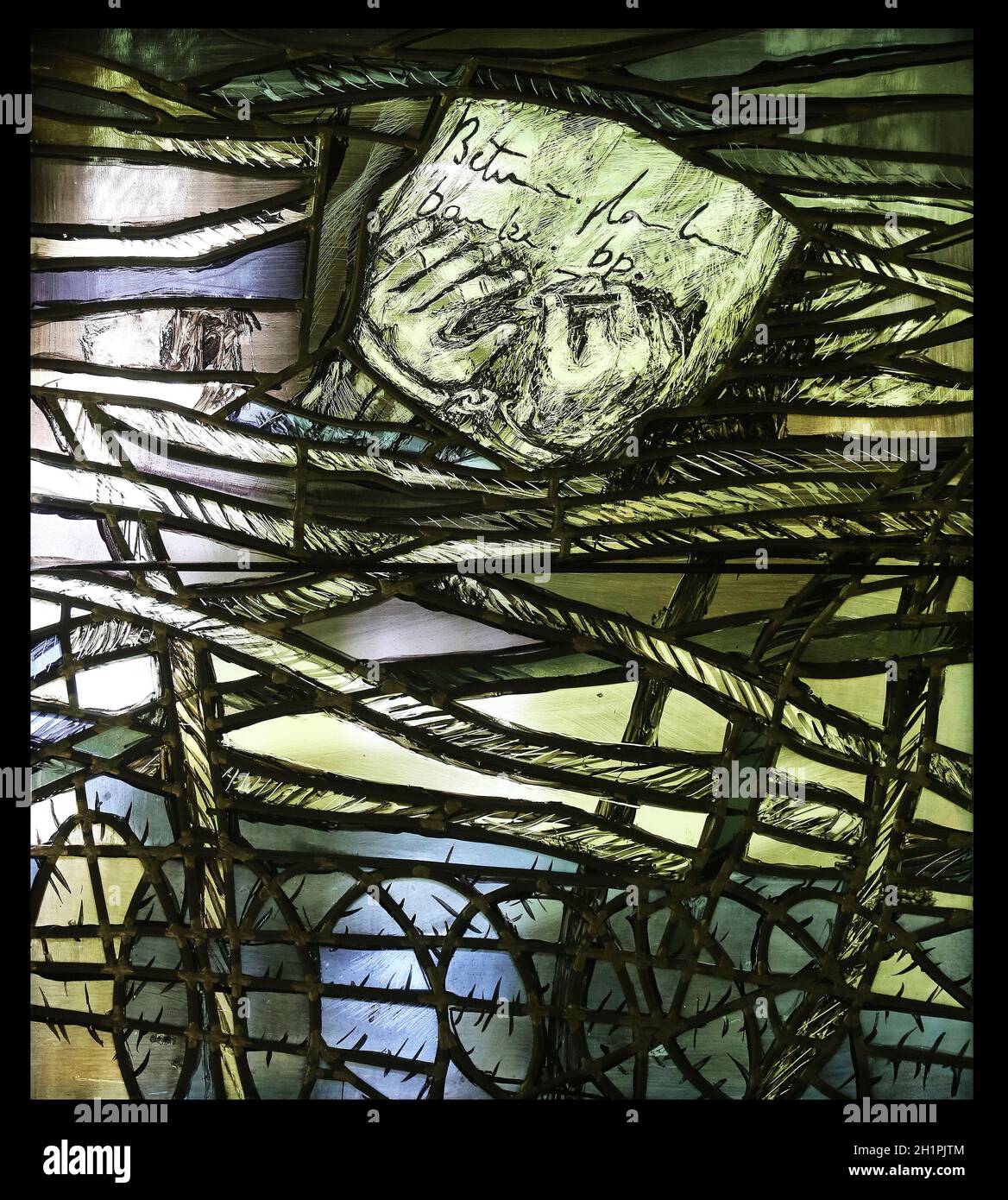 Simon of Cyrene carries the cross, detail of stained glass window by ...