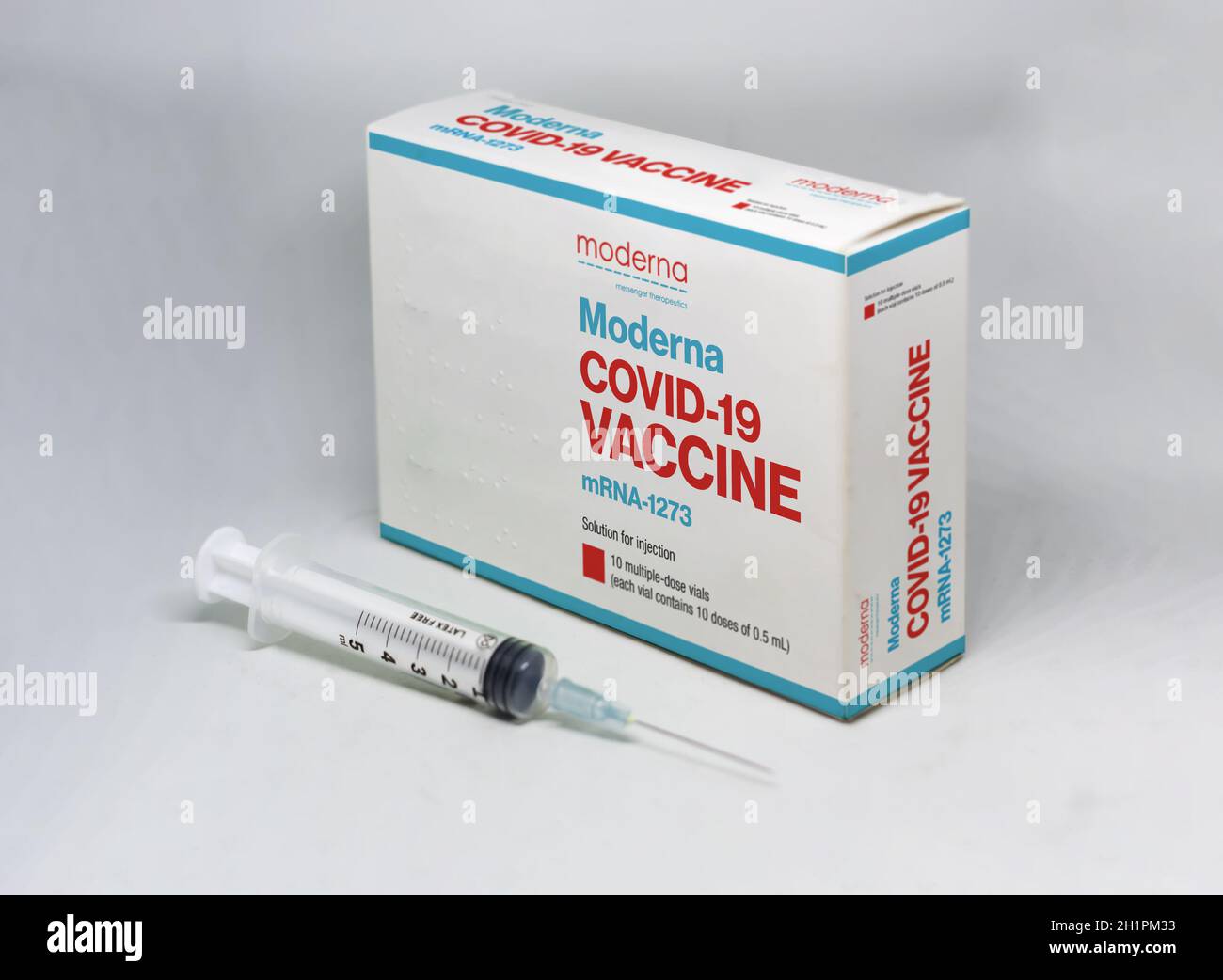 Cambridge, MA, USA, february 5th 2021: A syringe next to the ModeRNa ...