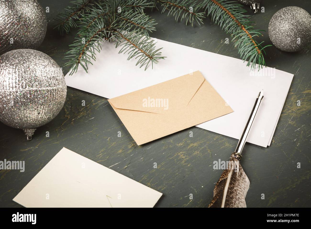 Christmas background with letter, envelope and feather pen surrounded ...
