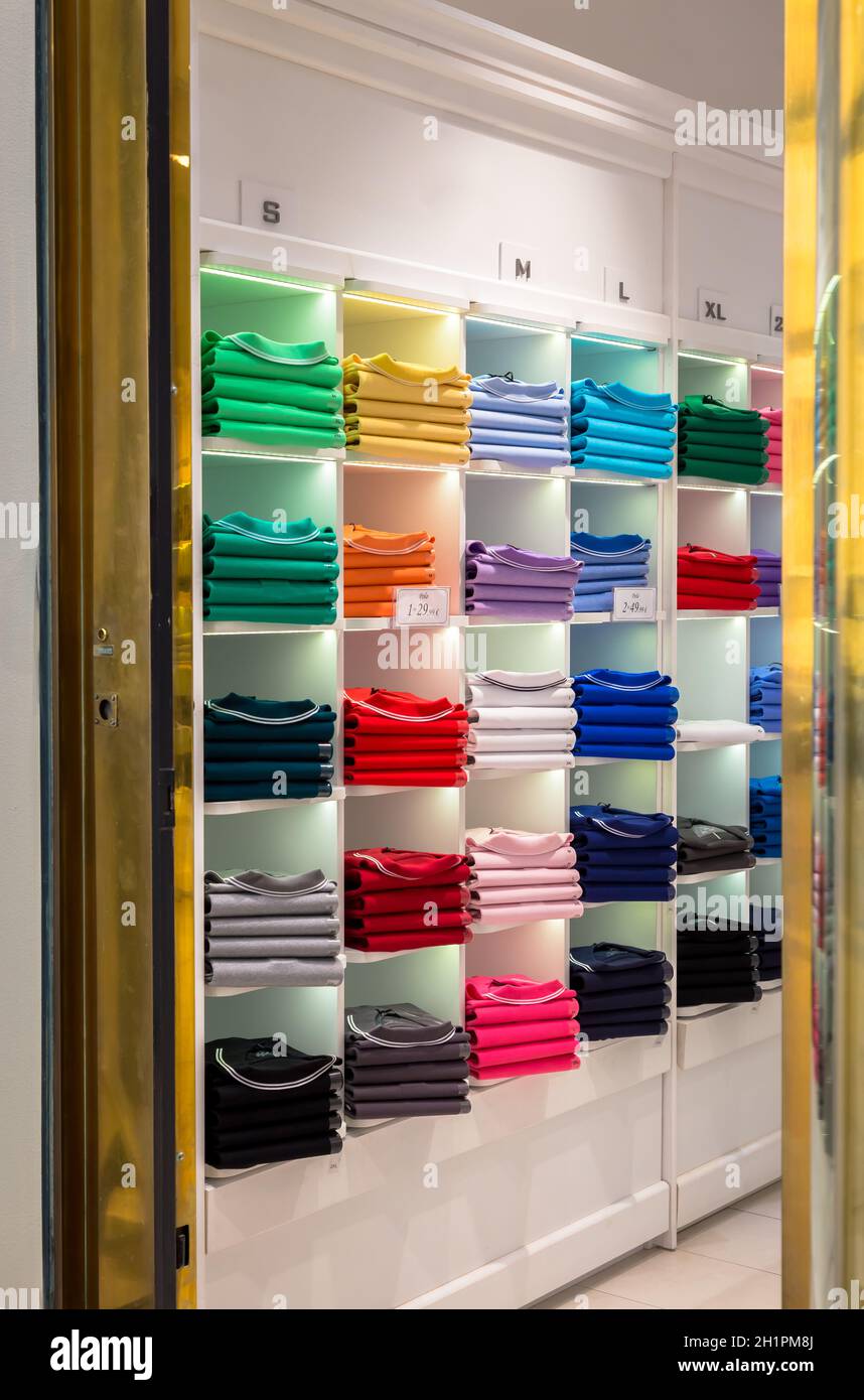 Polo shirt shop interior - fashion store Stock Photo - Alamy
