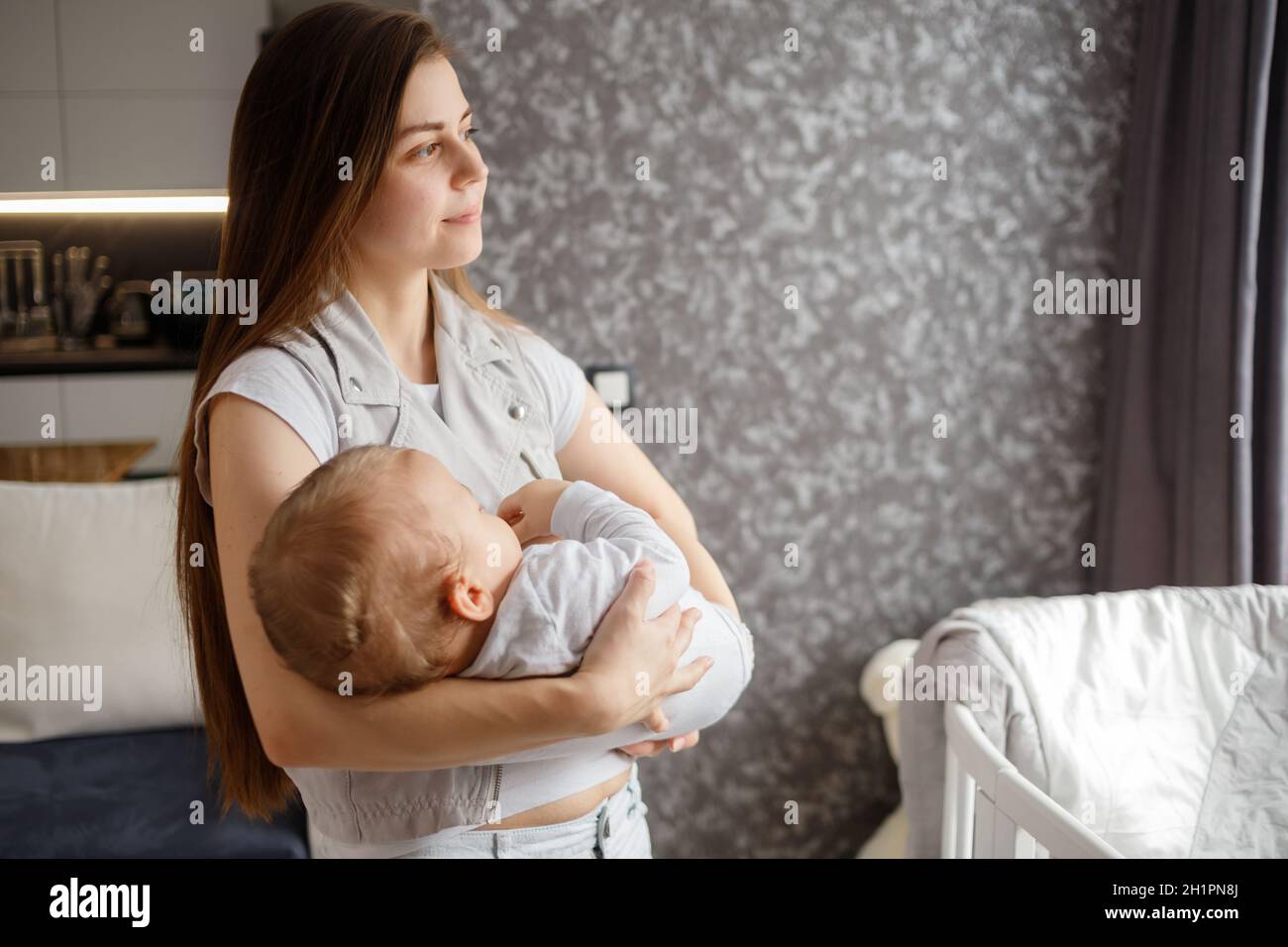 Infant baby falled asleep in mother arms. Home photo. Lifestyle ...