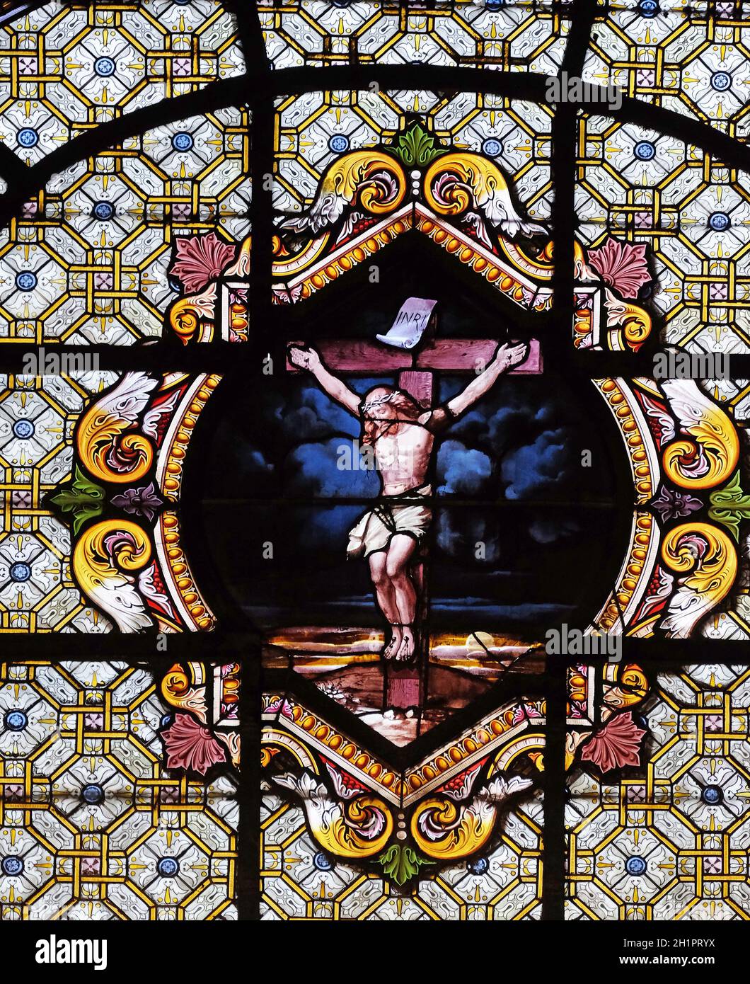 Jesus Christ on the cross, stained glass window in the Saint Sulpice ...