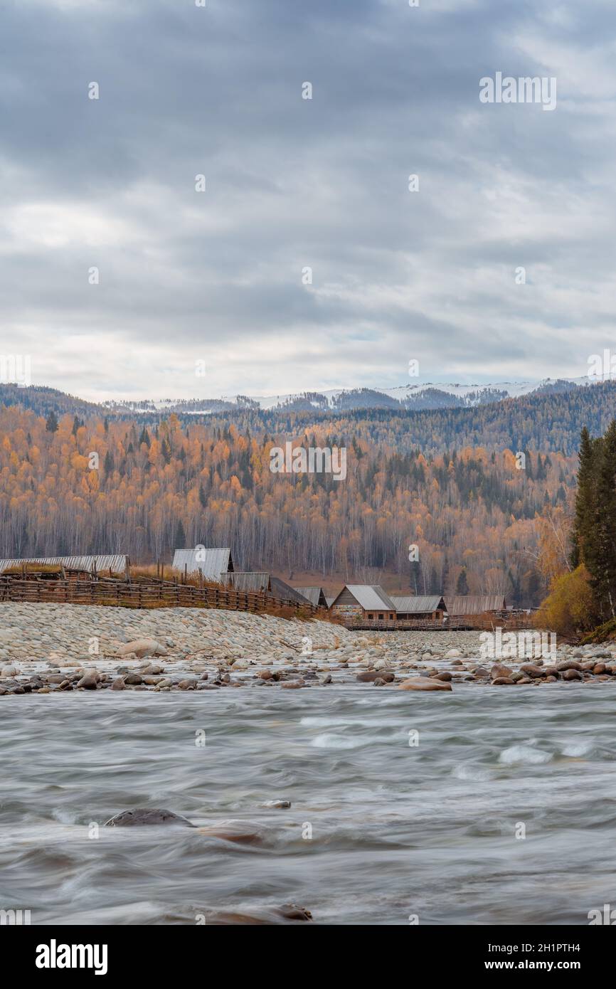 Autumn landscape of the river and forest in Hemu Village, a historic ...