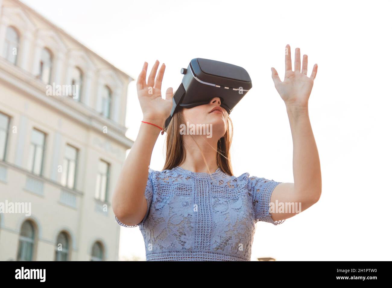 Young Woman enjoy with VR device outdoor Stock Photo - Alamy