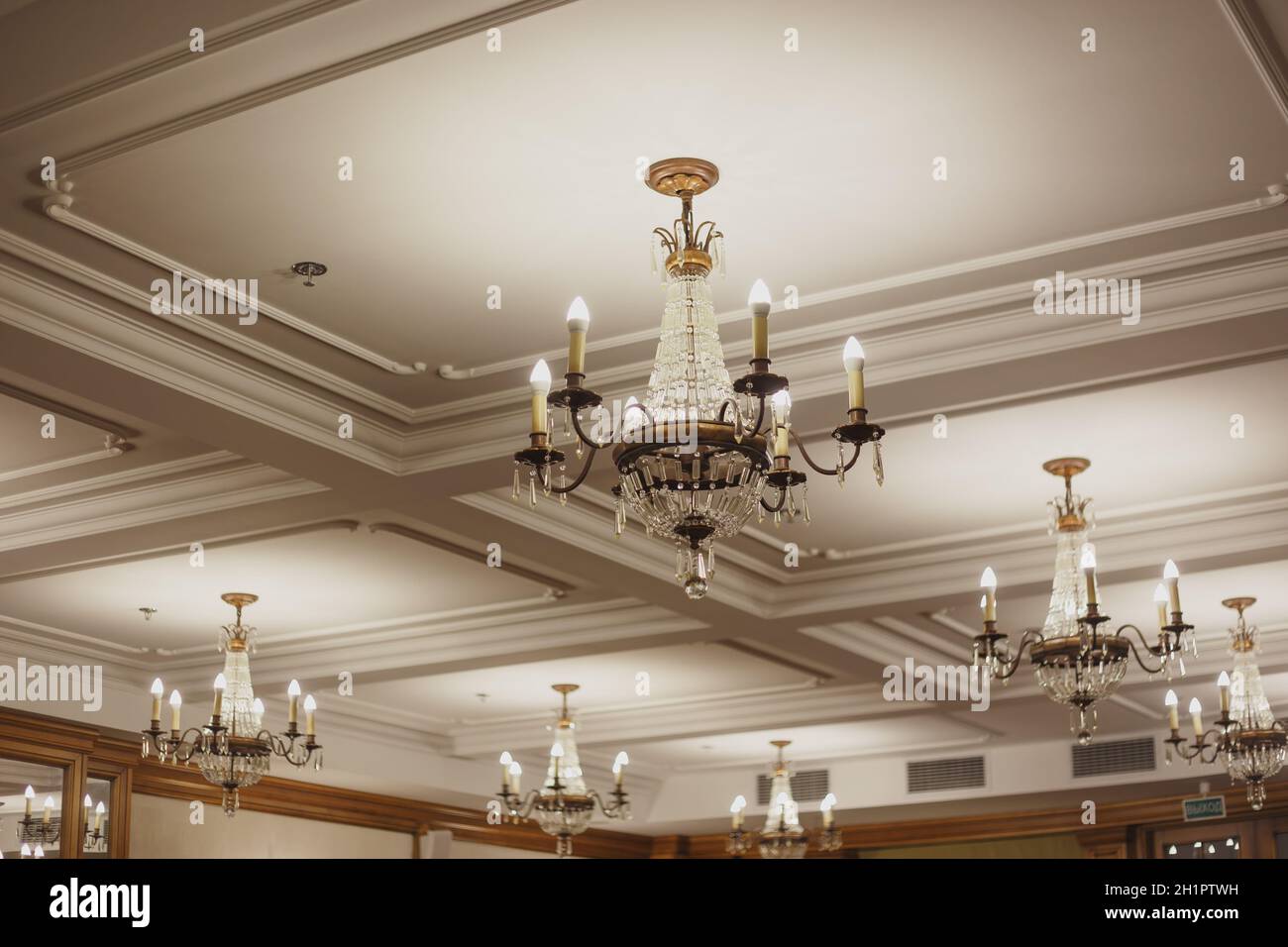Coffered ceiling with classic crystal chandeliers in the interior Stock ...